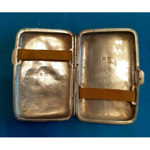 A small hallmarked silver cigarette case with engine turned engraving ...