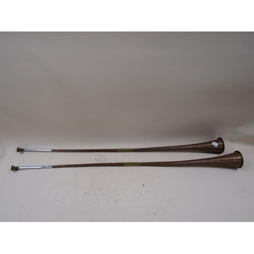TWO COPPER COACHING HORNS, 120CM L