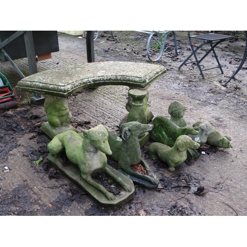 COLLECTION OF GARDEN STATUES AND A GARDEN BENCH
