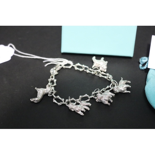 Tiffany and Co charm bracelet dog bone chain and 5 dog charms, with ...