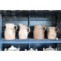 Lot of four large antique French stoneware jugs with loop handles ...