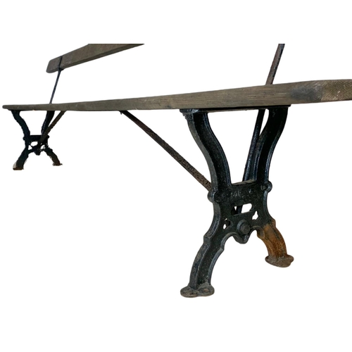 Late 19th century J.P. Corry cast iron reversible railway bench. 273cm