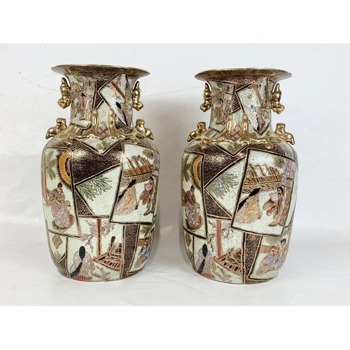 A large pair of reproduction hand painted Satsuma vases, 36cm