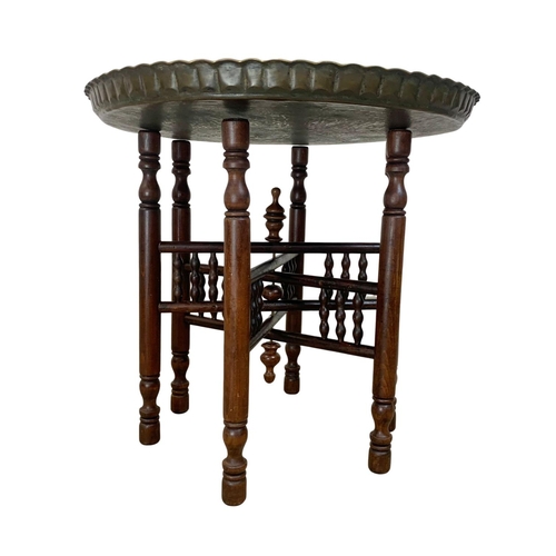 A vintage brass top Benares table.