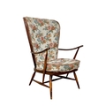 An Ercol model 478 Mid Century elm high back armchair.