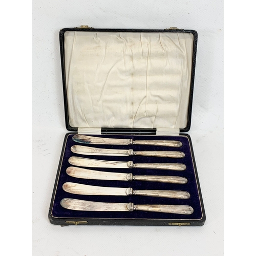 A set of 6 silver handles knives in case. London.
