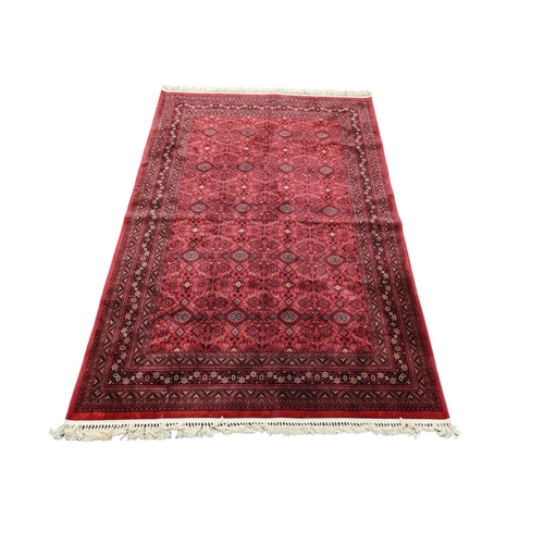 A large Middle Eastern rug. 197 X 308cm