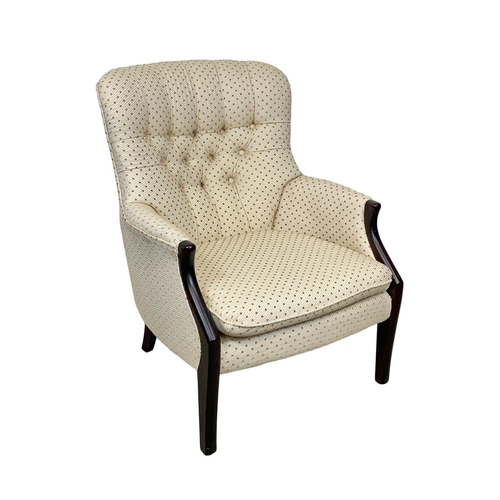 A button back armchair.