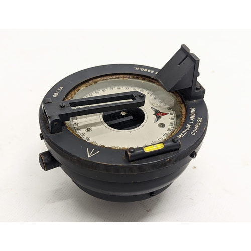 A WWII R.A.F "Medium Landing Compass." Stamped 1944. Compass measures ...
