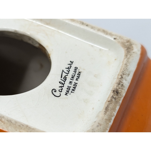 A Carlton Ware pottery money box. 16.5x14.5cm