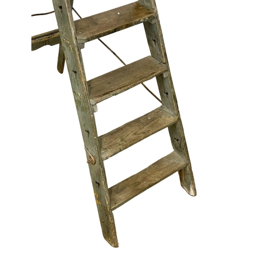 Early 20th century wooden ladders. Circa 1920. 157cm closed.