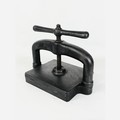 A large cast iron book press. 40x34cm