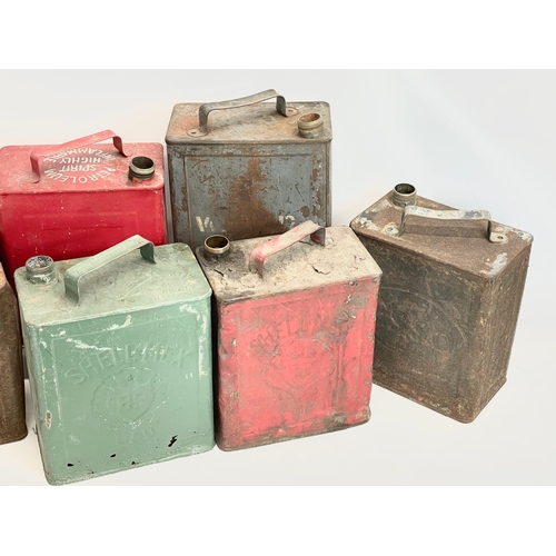 A quantity of vintage petrol cans. Including 2 Esso and 2 Shell.