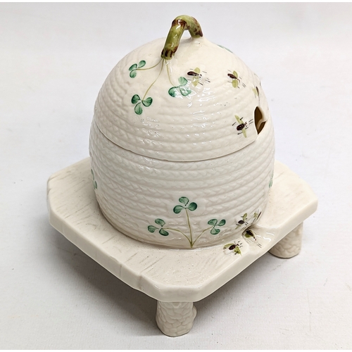 A vintage Belleek pottery honey pot, green stamp. 16cm