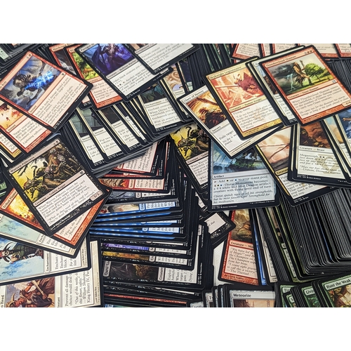 A large collection of Magic The Gathering playing cards.