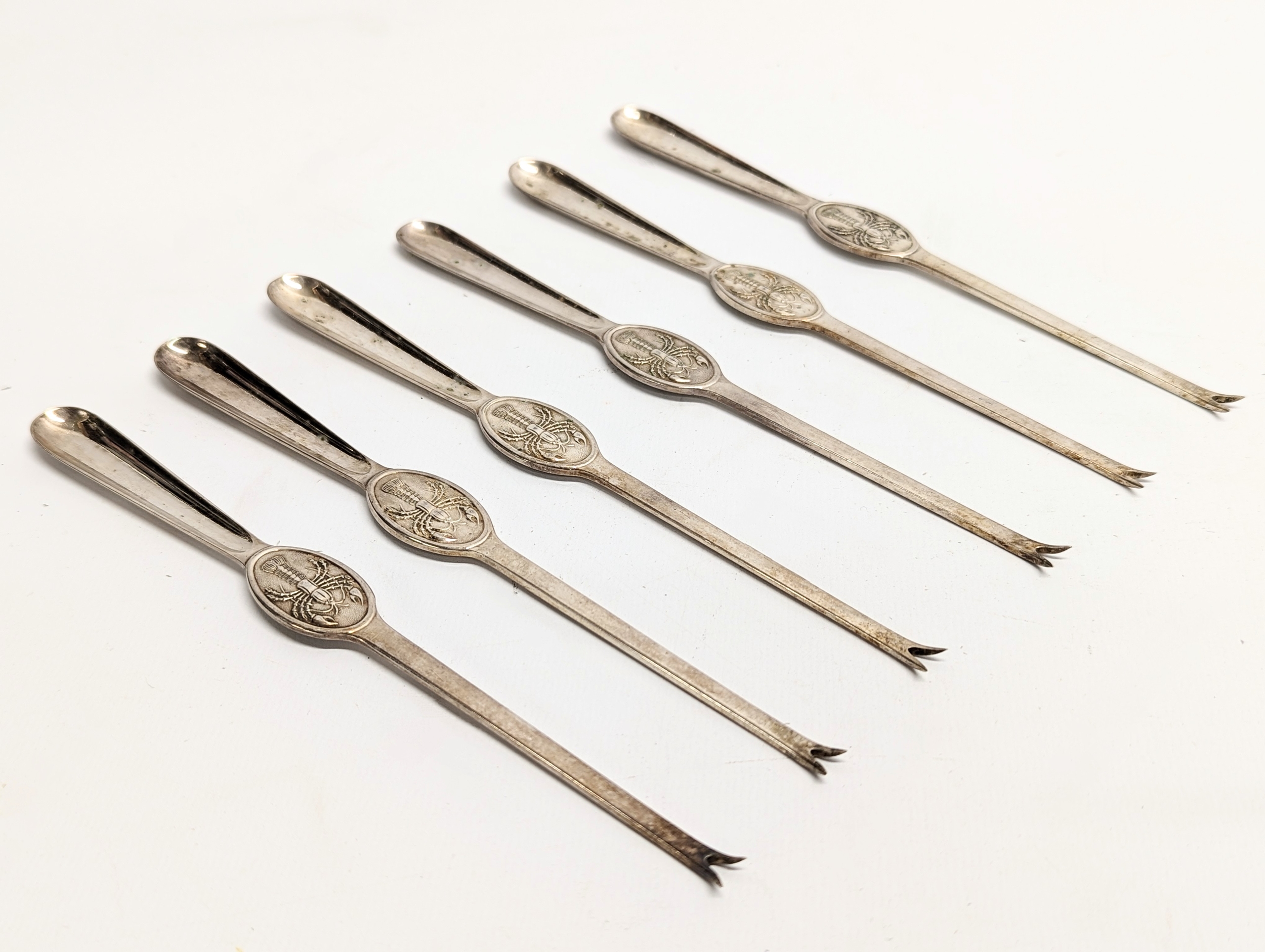 A set of 6 Swedish silver plated lobster forks.
