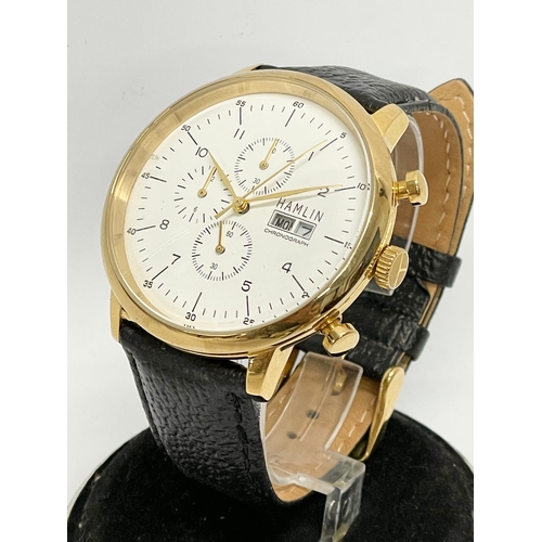 A gents watch by Hamlin with leather strap.