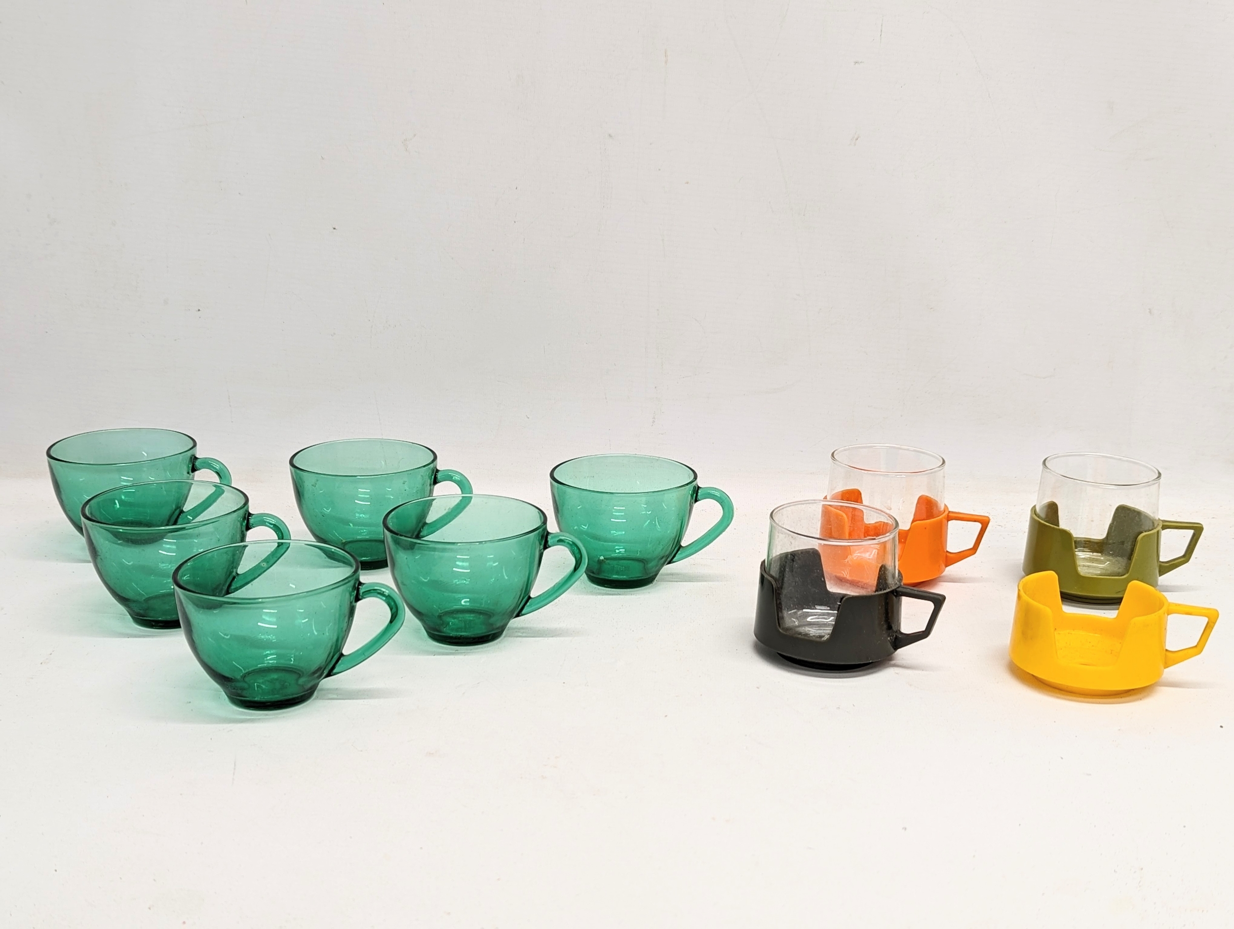 A set of vintage French drinking glasses with Pyrex cups.