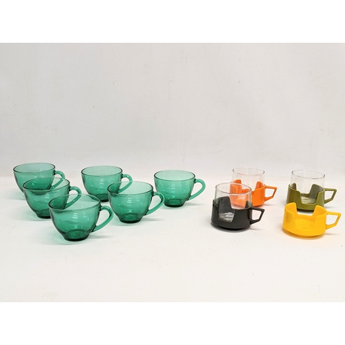 A set of vintage French drinking glasses with Pyrex cups.