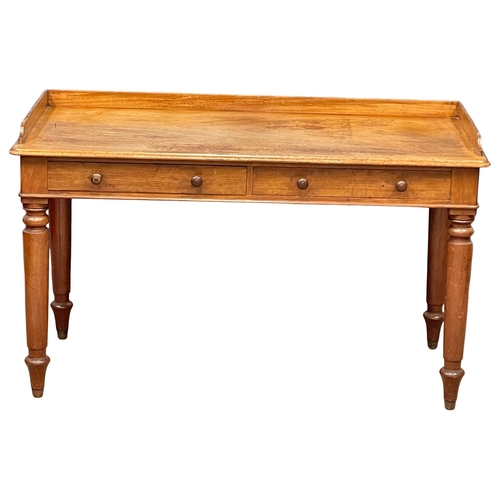 A Victorian mahogany gallery back side table with 2 drawers. 122x60x73.5cm