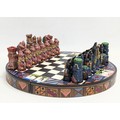 A painted medieval style chess set. Board measures 26cm