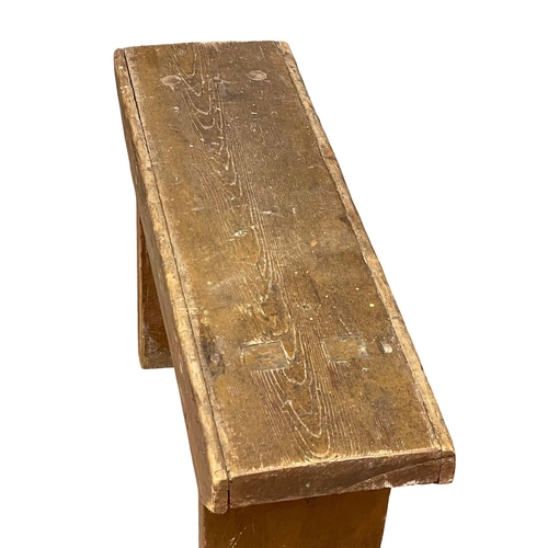 An early 20th century pine joiners stool. 85x26x51cm.
