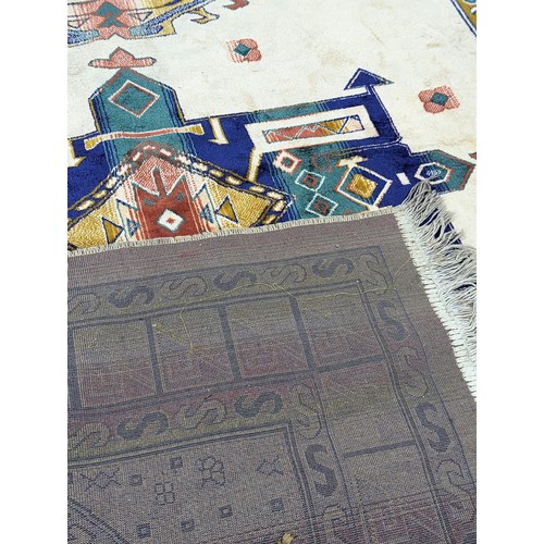 A vintage Middle Eastern style rug. 195x138cm