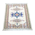 A vintage Middle Eastern style rug. 195x138cm