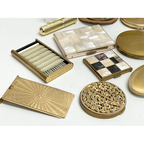 A collection of vintage compacts and perfume bottles