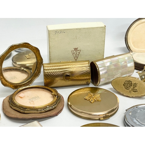 A collection of vintage compacts and perfume bottles