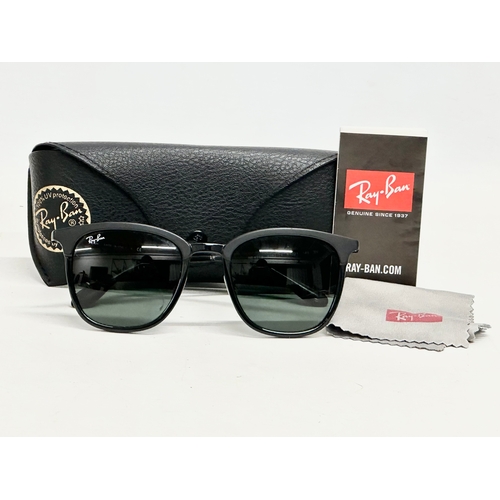 A pair of Ray Ban ‘Luxottica’ sunglasses with case.