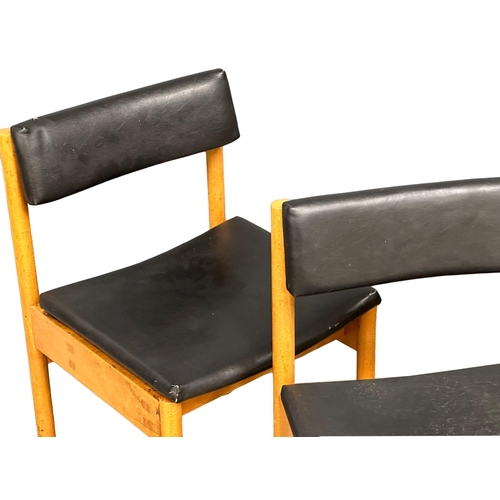 A set of 4 Mid Century dining chairs with black vinyl seats and backs ...