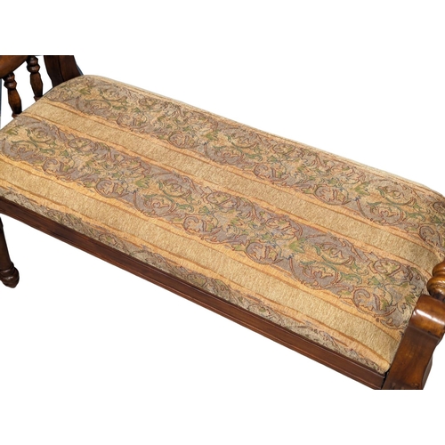 A Georgian style mahogany large window stool. 107x47x64cm