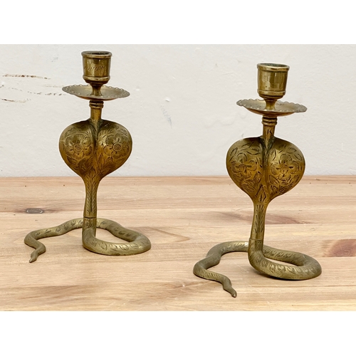 A pair of early 20th century brass snake candlesticks. 10x15cm