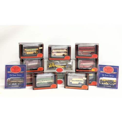 A collection of Exclusive First Edition model cars, buses and trucks.
