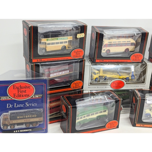 A collection of Exclusive First Edition model cars, buses and trucks.