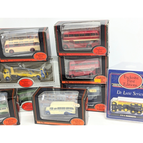 A collection of Exclusive First Edition model cars, buses and trucks.
