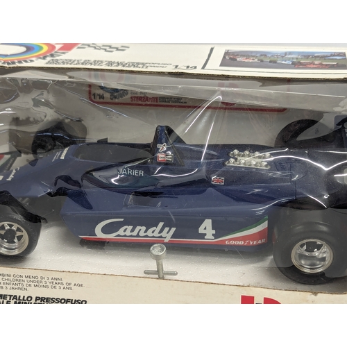 A Burago model Grand Prix racecar, Candy Tyrrell. 1/14 scale. Box ...