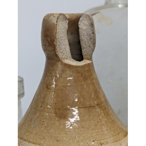 A collection of late 19th / early 20th century glass and stone bottles ...