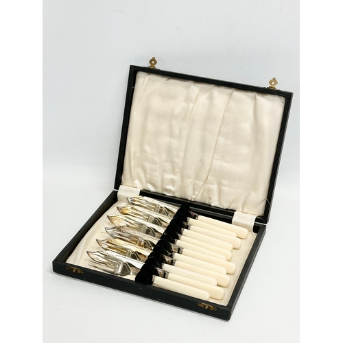 A set of early 20th century ornate silver plated cutlery in case by H ...