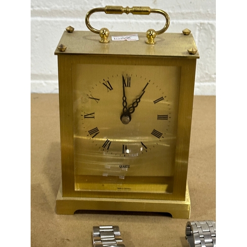 A German brass mantle clock with costume jewellery and cufflinks.