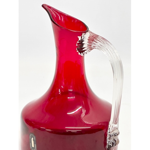 A Ruby Glass jug designed by Geoffrey Baxter for Whitefriars. 12x17cm