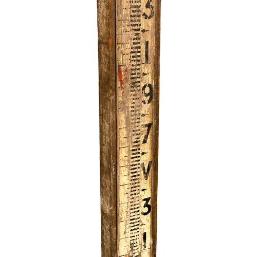 A large vintage surveyors telescopic measuring stick. Closed 190cm ...