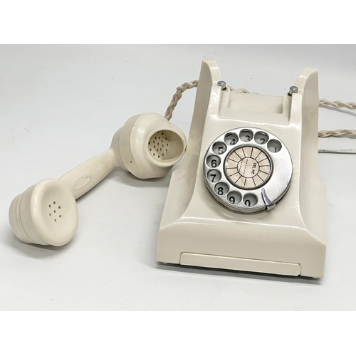 A 1950’s Bakelite ivory telephone.