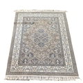 A vintage Middle Eastern style rug. 140x212cm