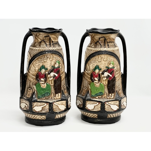 A pair of Early 20th Century Plaza Ware pottery vases. 31cm