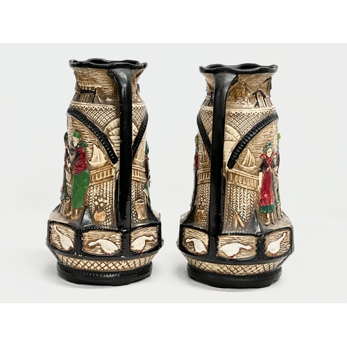 A pair of Early 20th Century Plaza Ware pottery vases. 31cm