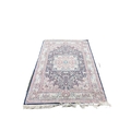 A large good quality Middle Eastern hand knotted rug. 168x256cm