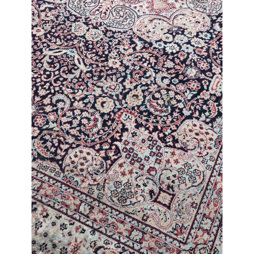 A large good quality Middle Eastern hand knotted rug. 168x256cm