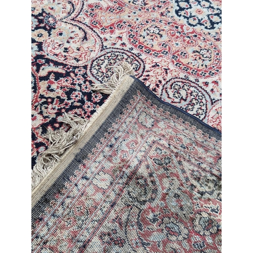 A large good quality Middle Eastern hand knotted rug. 168x256cm